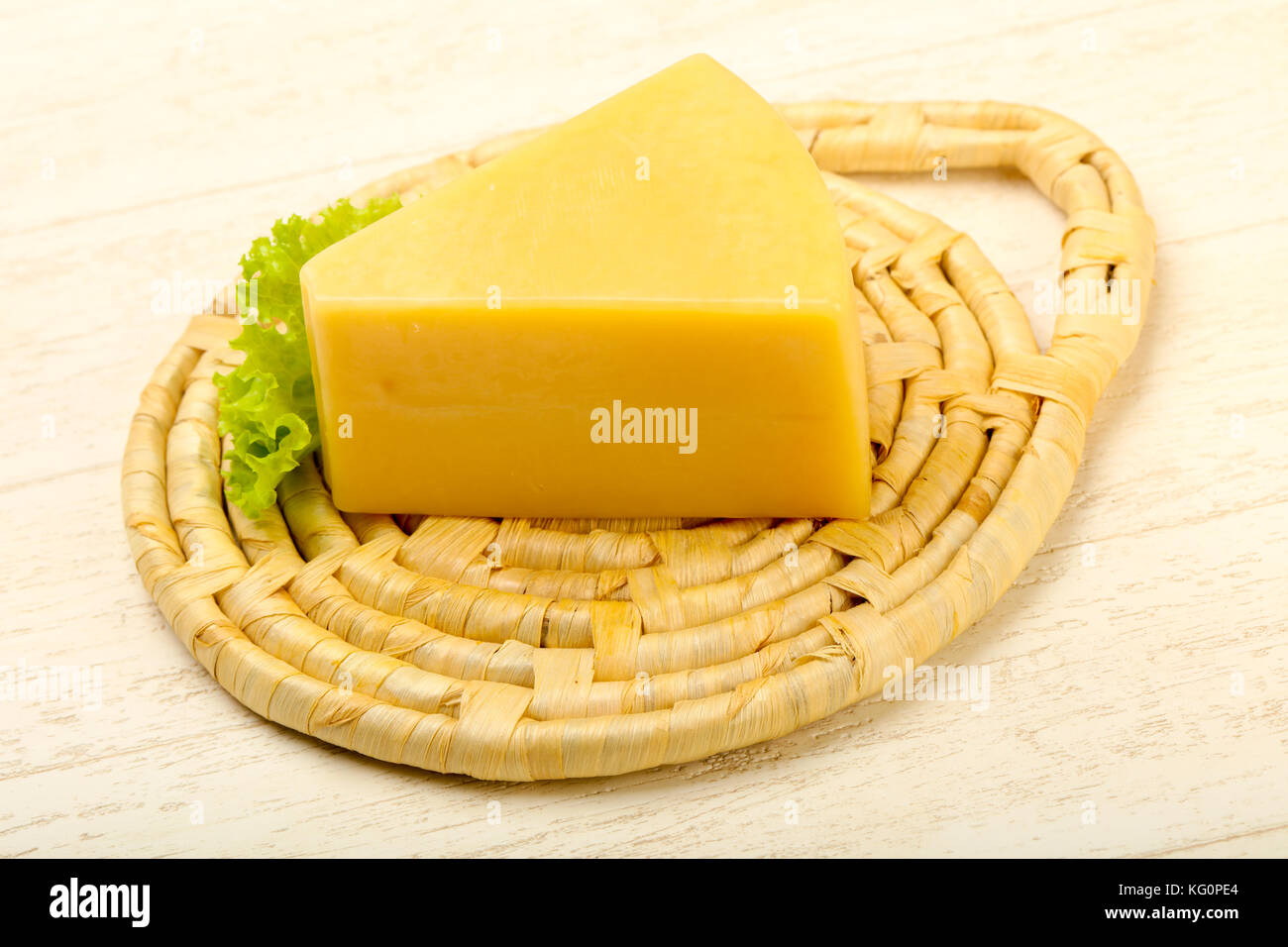 Parmesan cheese triangle Stock Photo - Alamy
