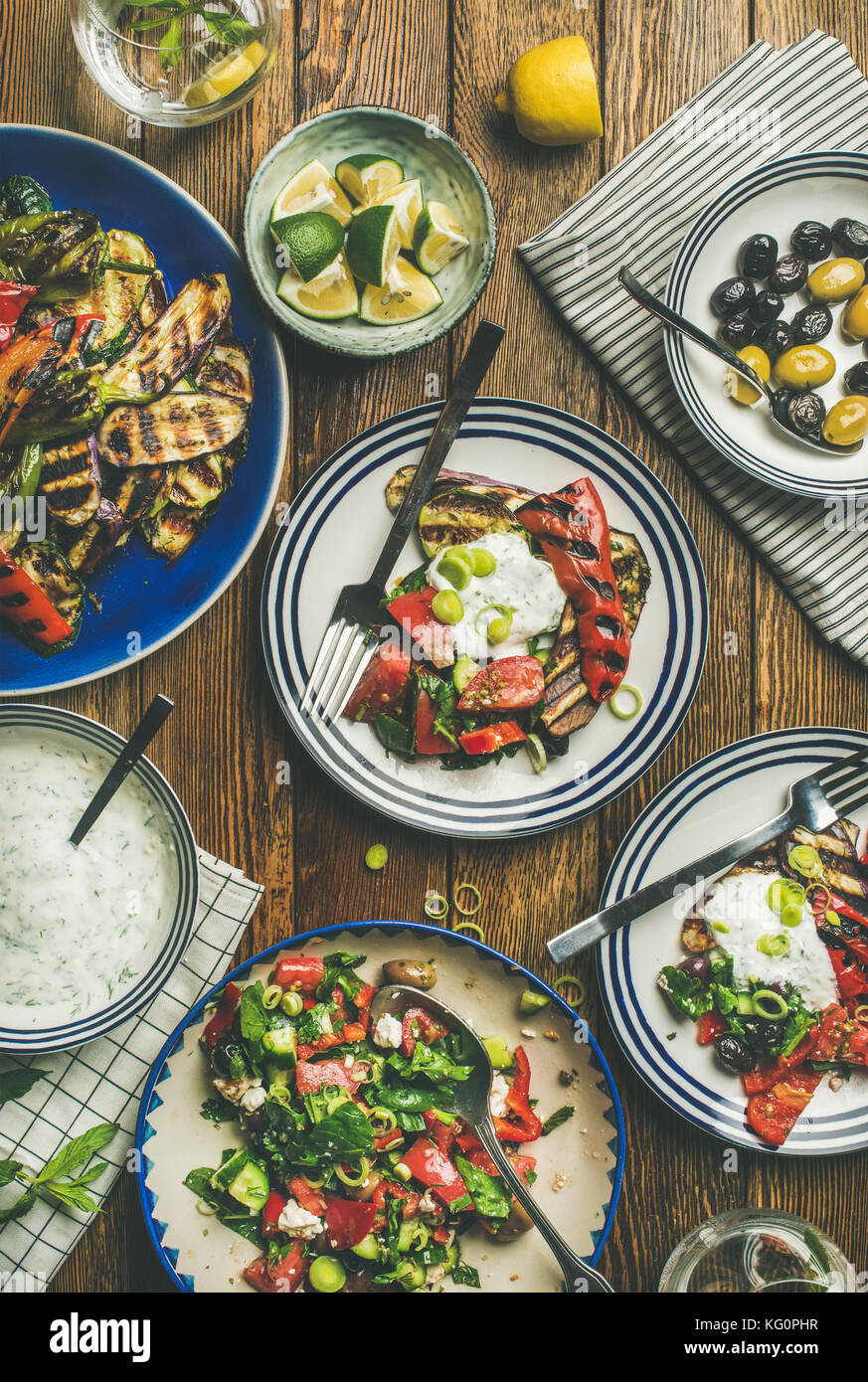 Flat-lay of healthy dinner table setting with salad and snacks Stock ...
