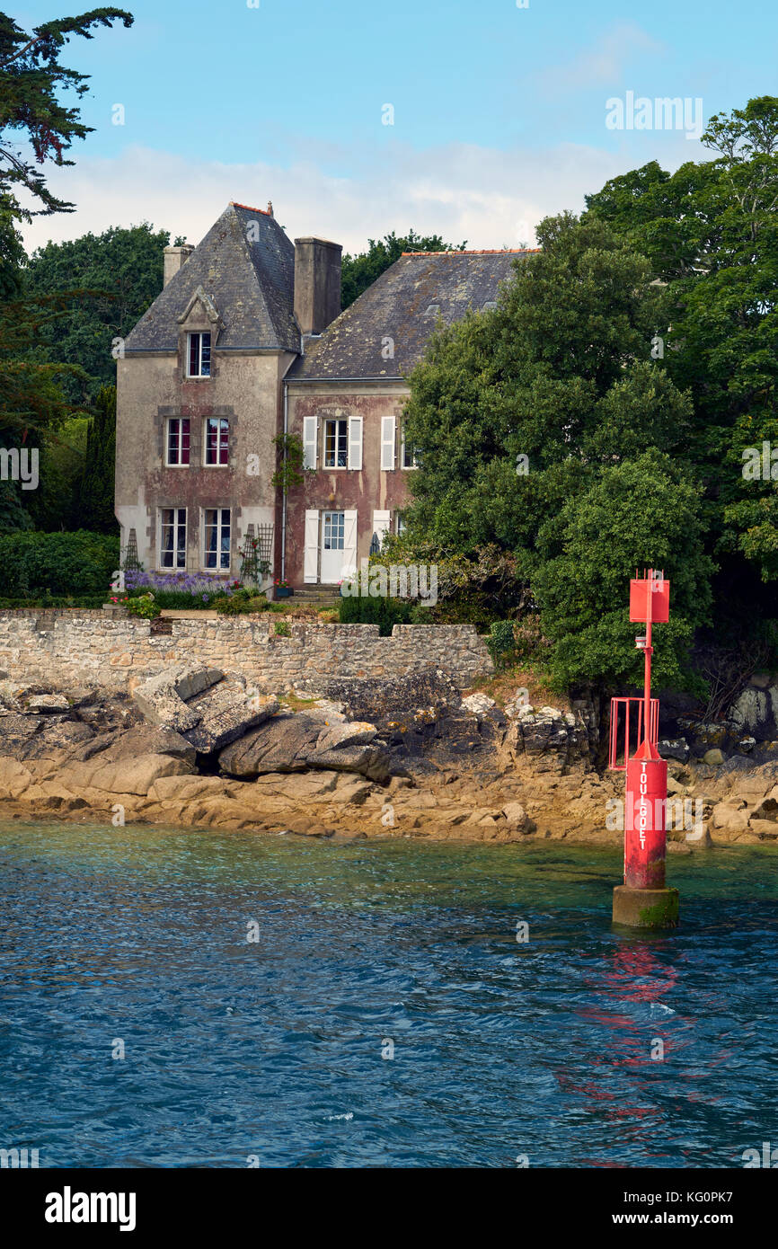 A red port navigation marker on the French coast Stock Photo - Alamy