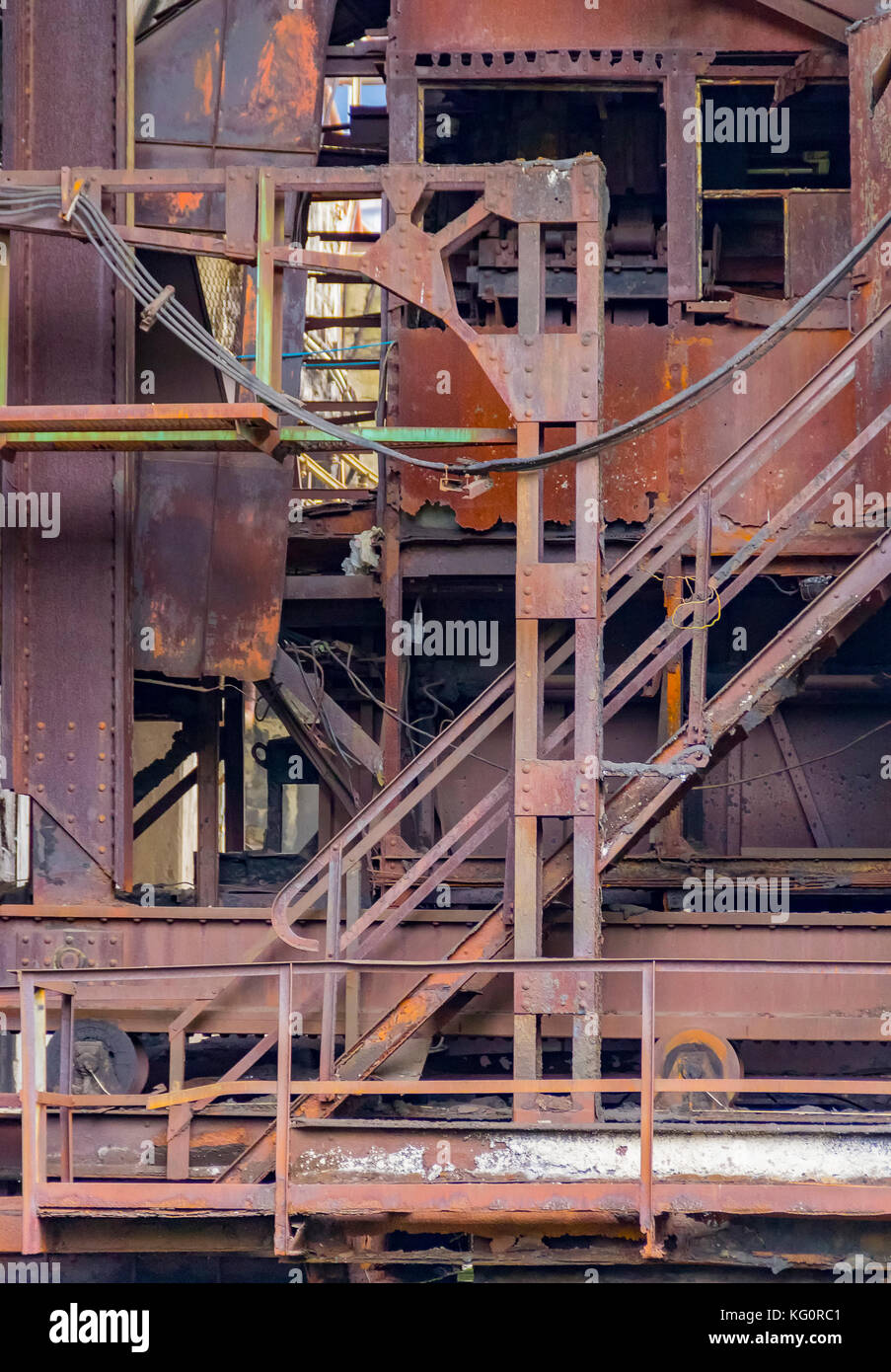 weathered rundown industrial scenery with old corroded steel girders ...