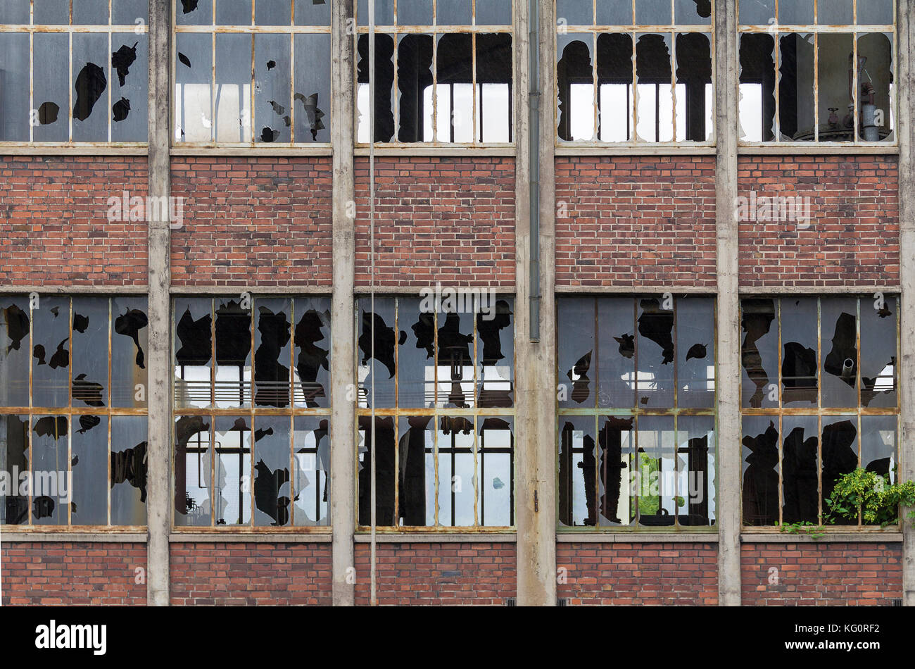 weathered industrial building detail with old rundown windows Stock ...