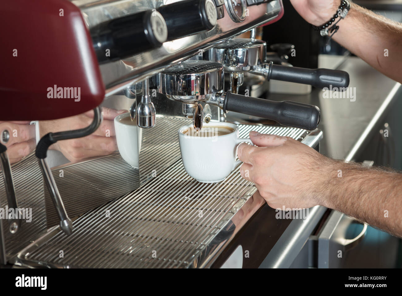 Close-up of espresso pouring from coffee machine Stock Photo - Alamy