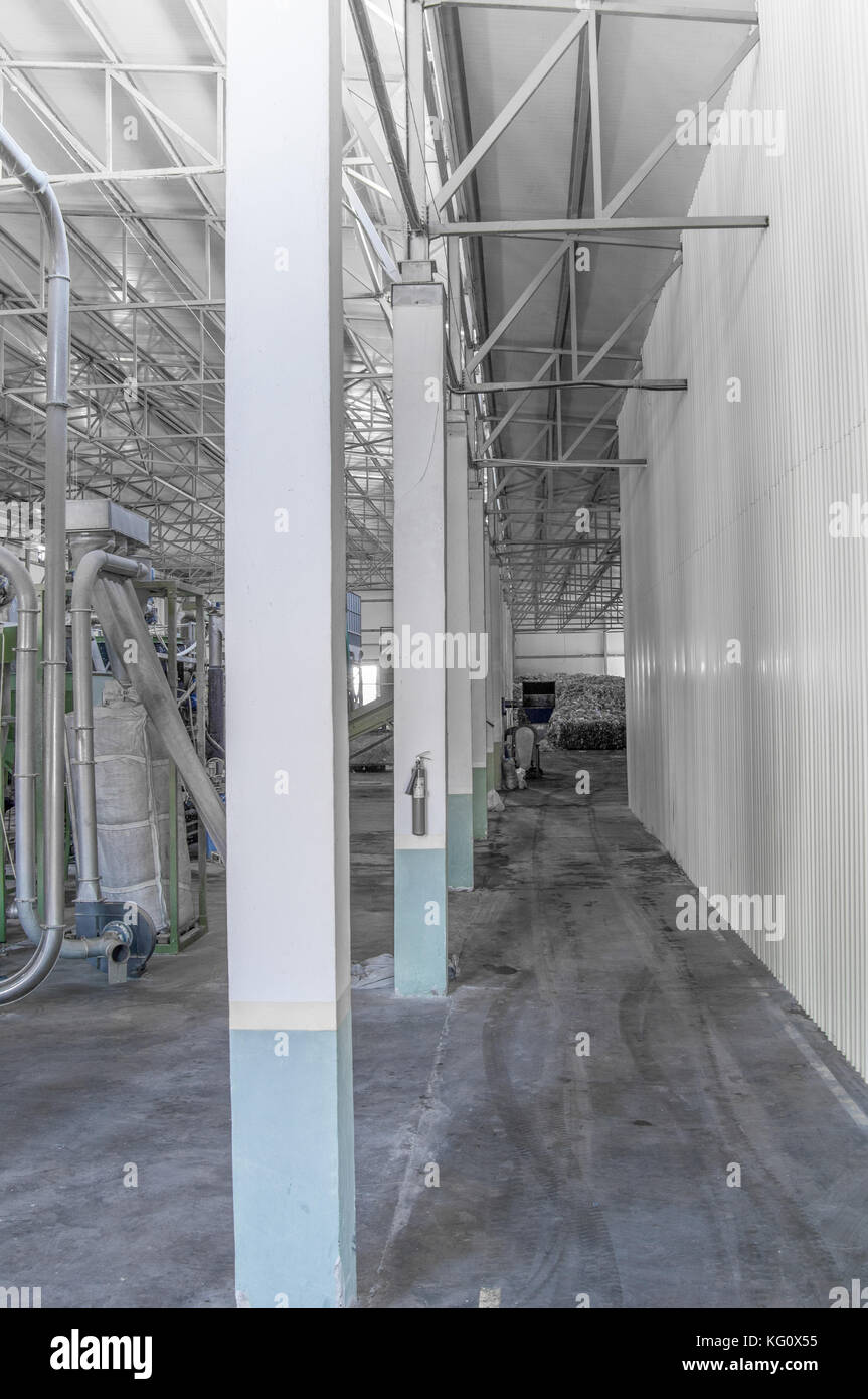 closeup row of columns at the factory for processing and recycling of ...