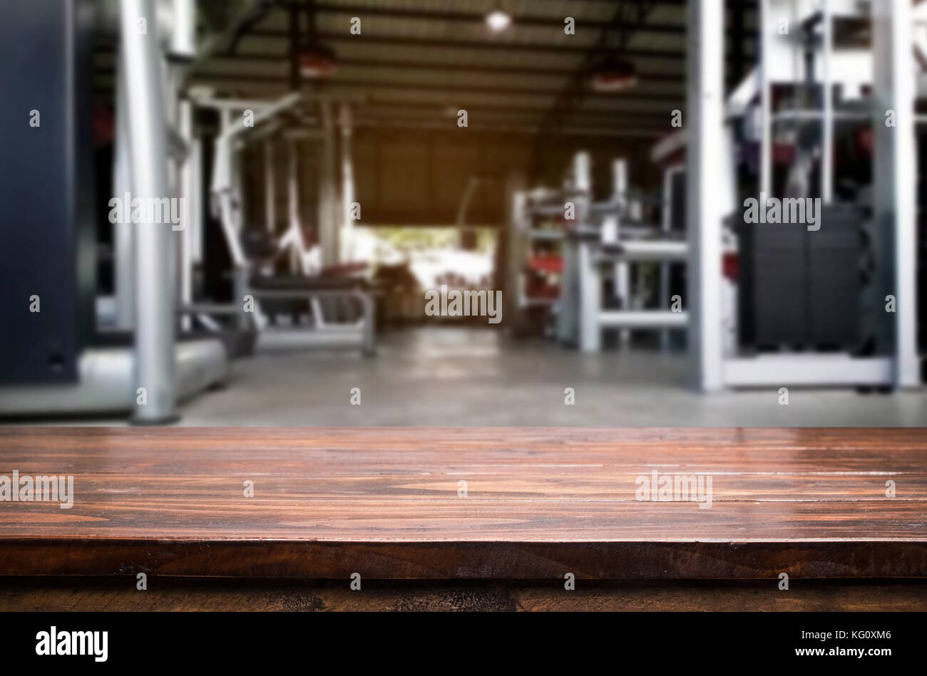 Wooden table on blurred background of fitness gym interior of modern ...
