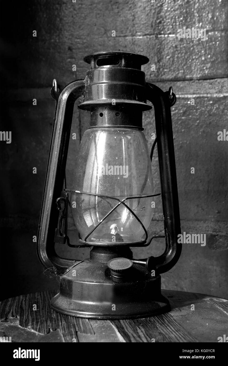 Abstract still life displaying German gas lantern on wooden table ...