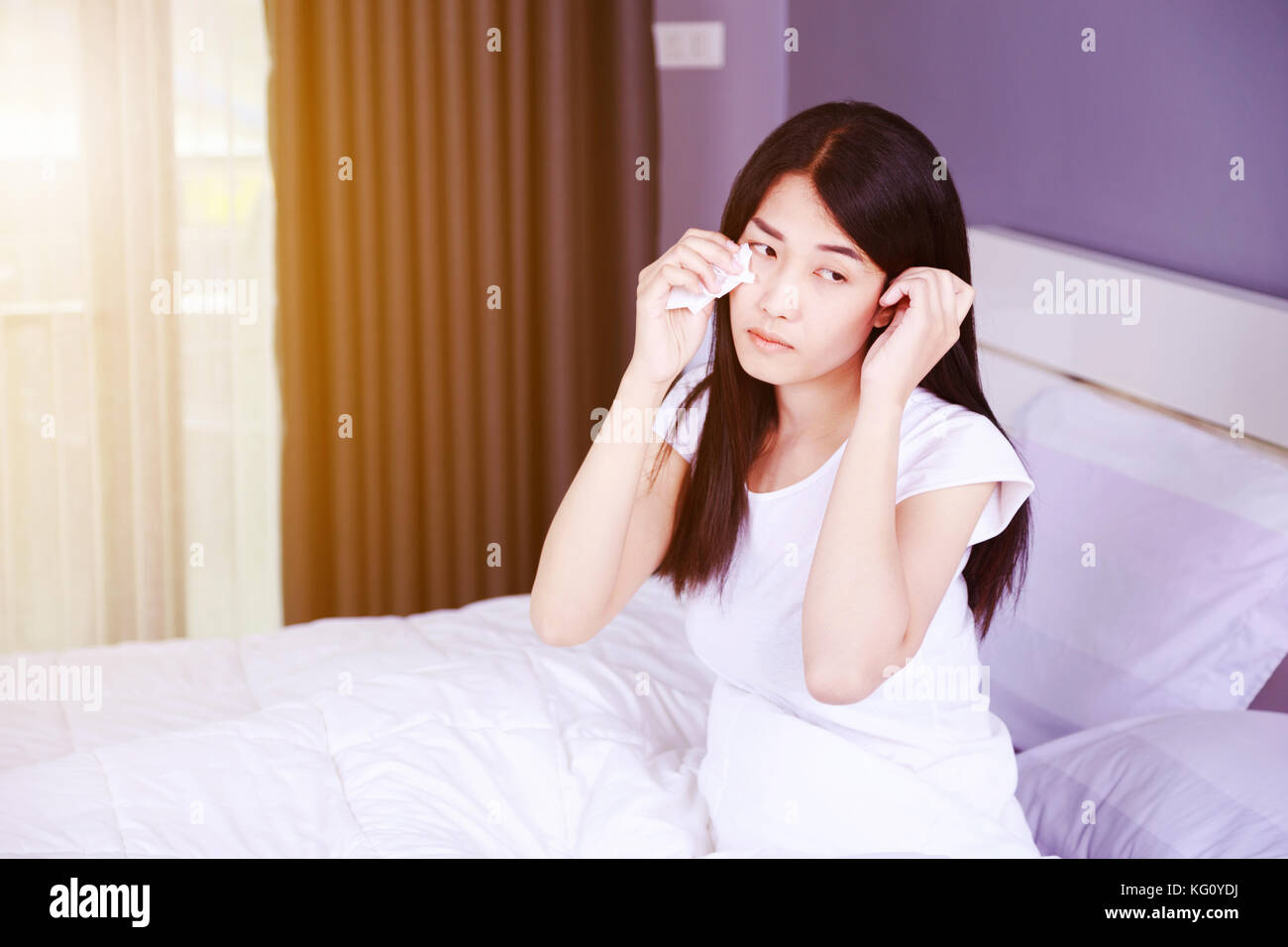 woman is crying on bed in the bedroom Stock Photo - Alamy