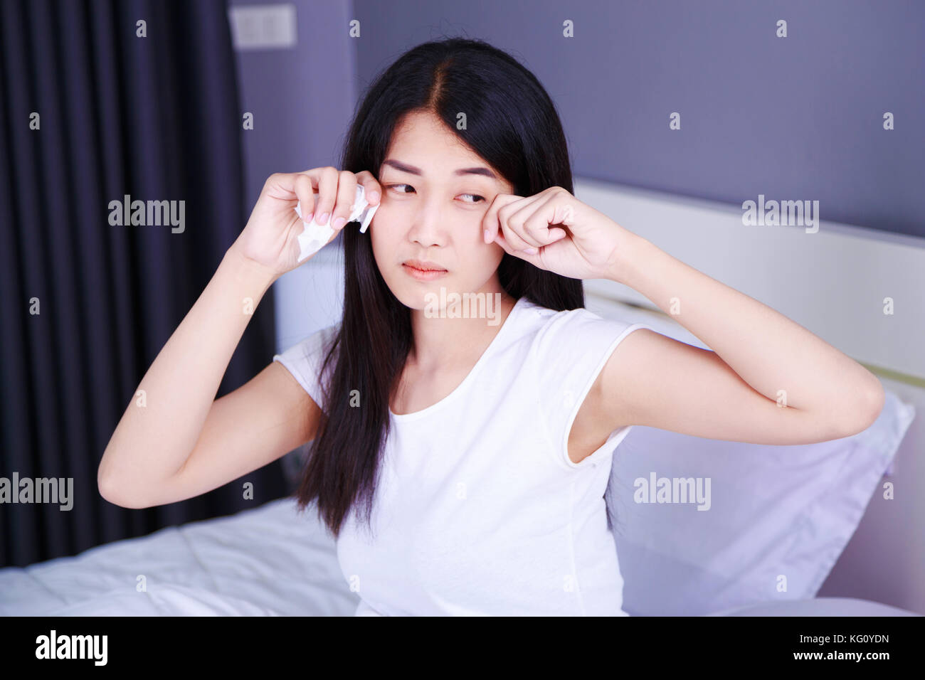 woman is crying on bed in the bedroom Stock Photo - Alamy