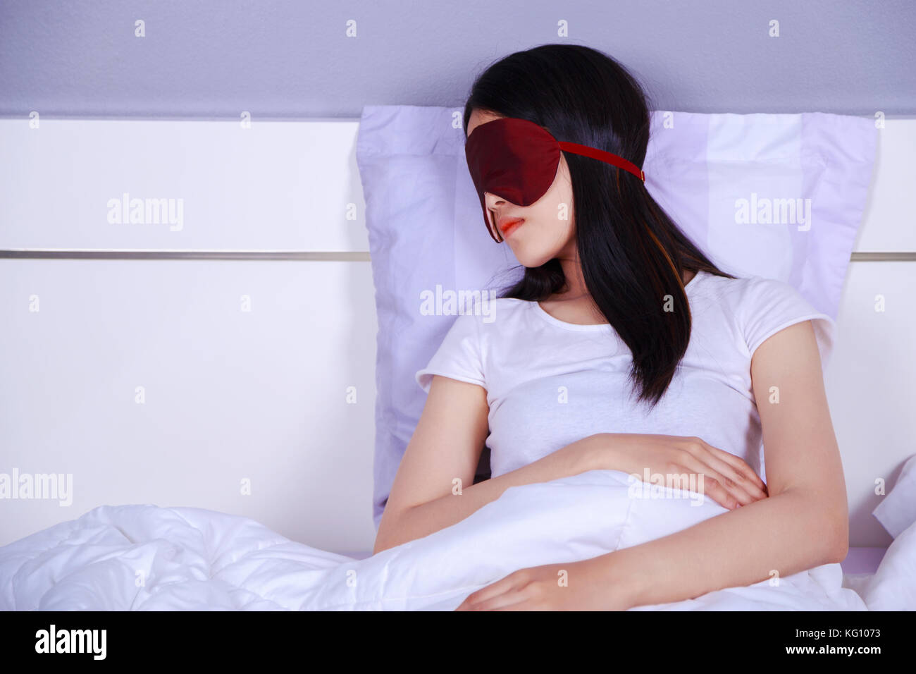 woman sleeping with eye mask on bed in the bedroom Stock Photo - Alamy