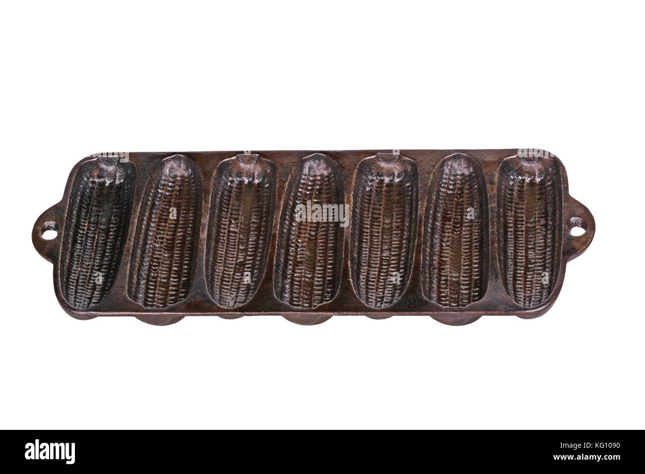 Old but seasoned cast-iron pan ready for baking cornbread sticks in the ...