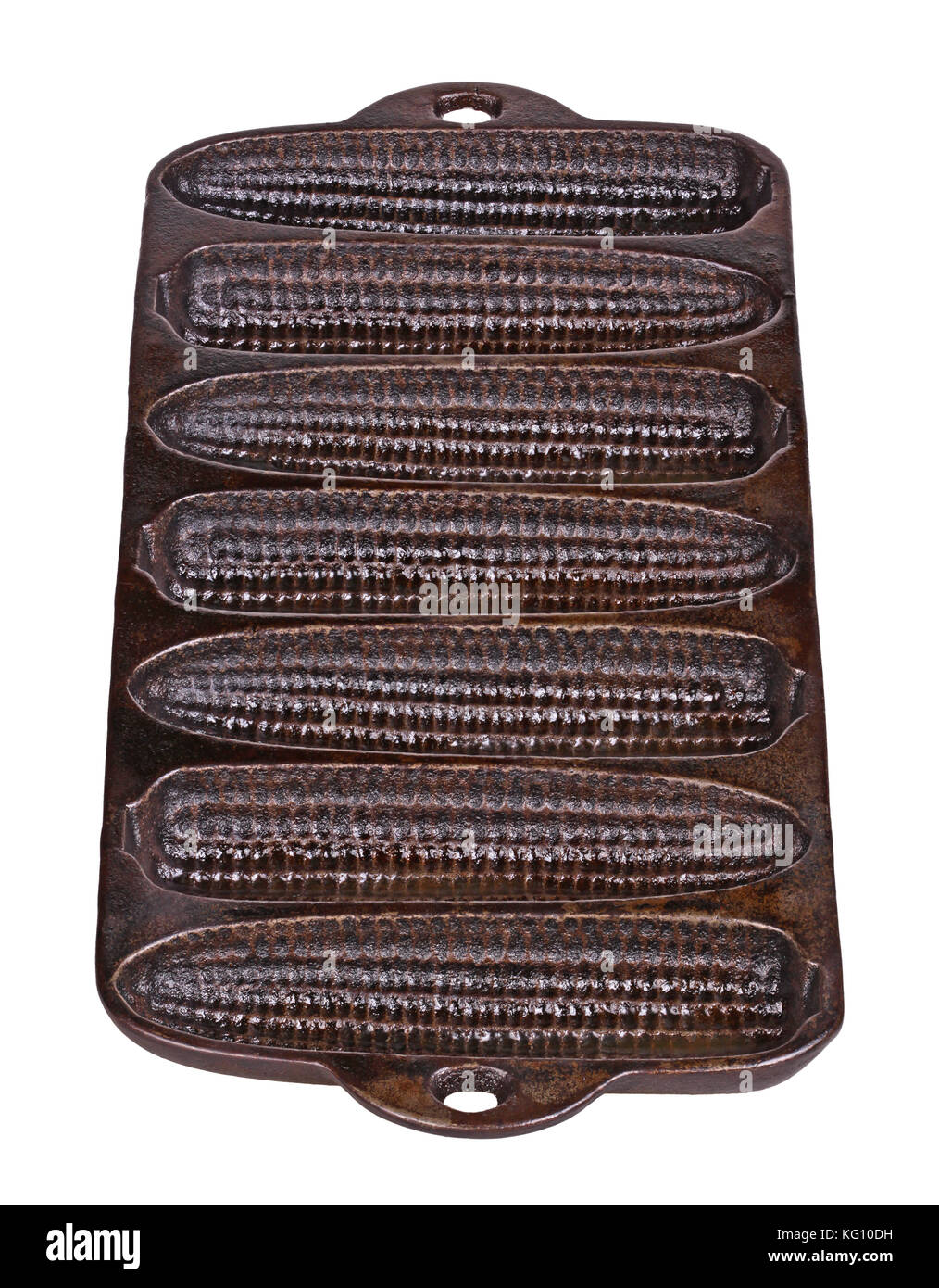 Old but seasoned cast-iron pan ready for baking cornbread sticks in the ...