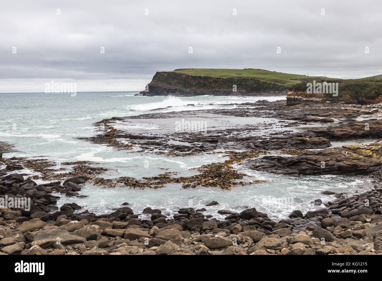 The wild Curio Bay cliffs in the Catlins area by the Tasman sea in New ...
