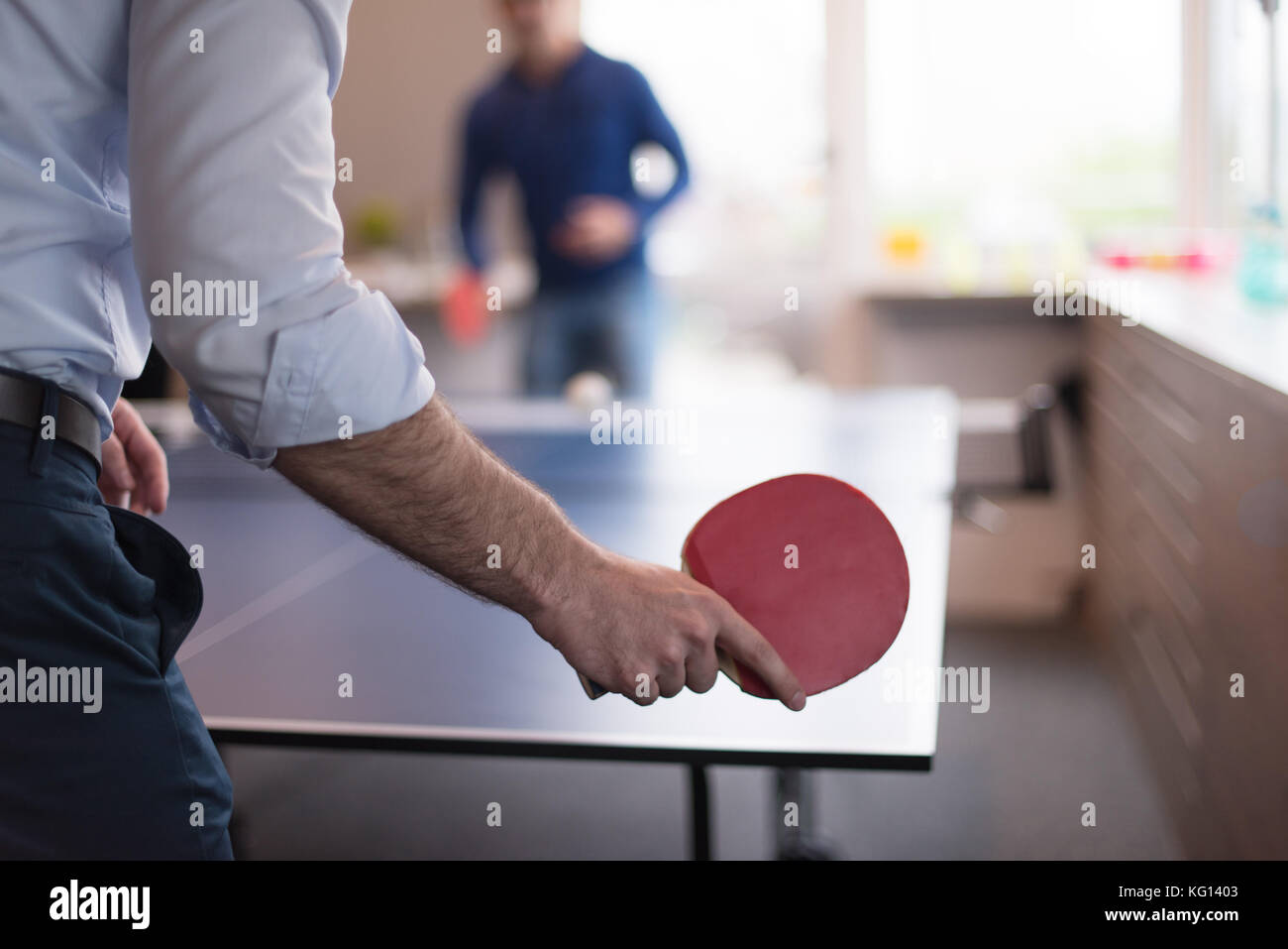 group of young startup business people playing ping pong tennis at ...
