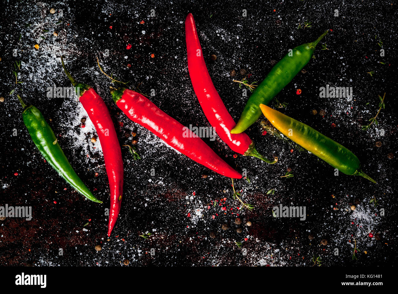 Spices for cooking. Spicy red and green chilli peppers on old metal ...