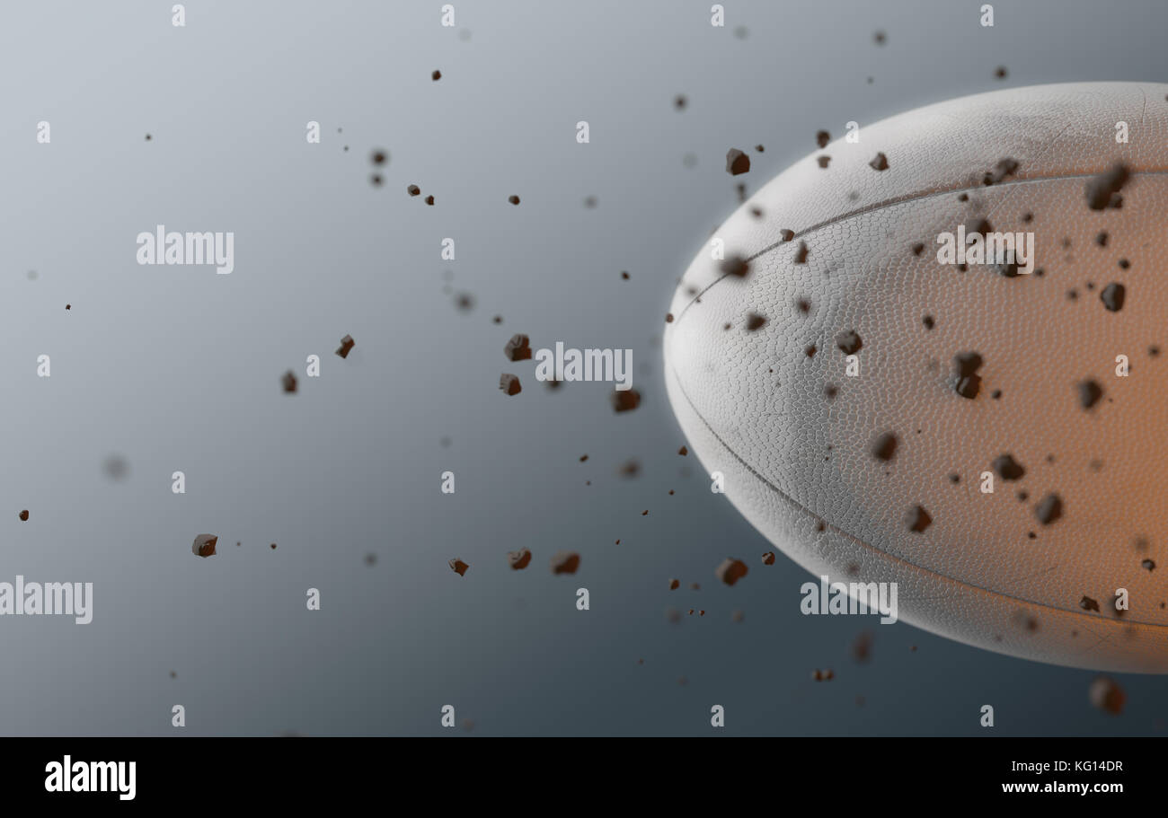 A dirty white rugby ball caught in slow motion flying through the air ...