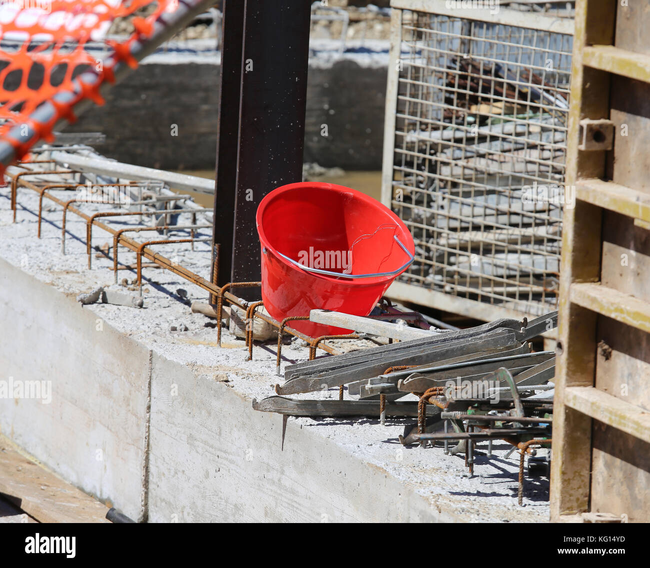 red plastic bucket in the construction site during the masonry strike ...