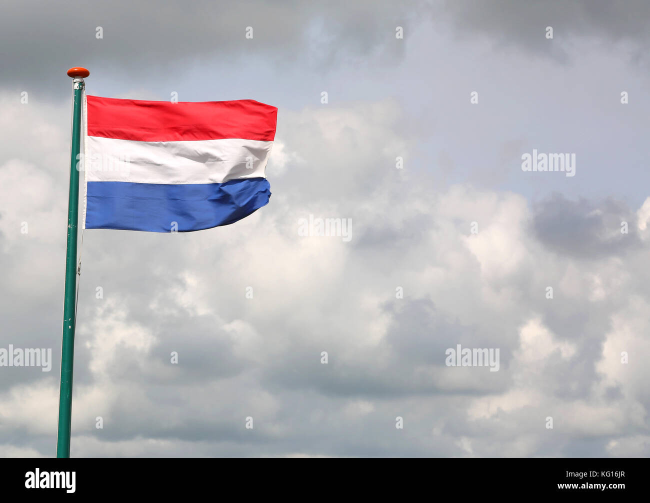 Dutch flag waving with cloudy sky background waiting for rain Stock ...
