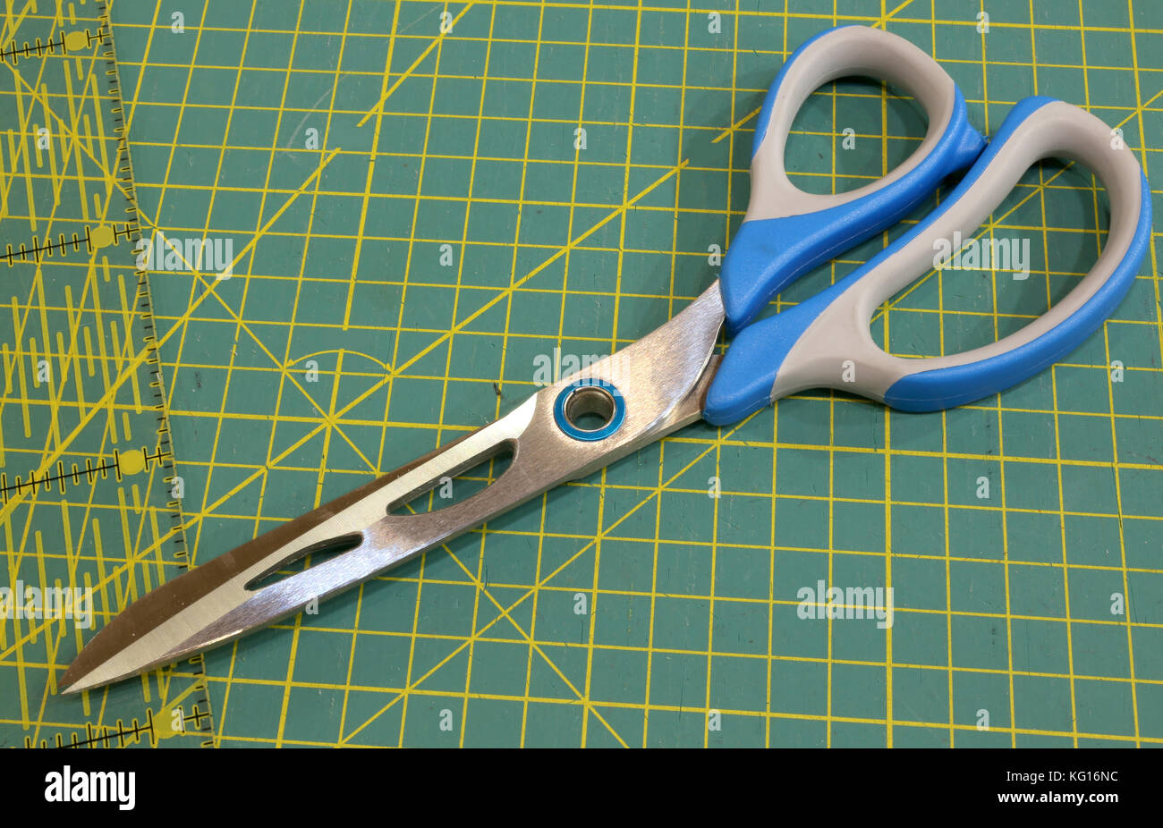 big tailor scissors and shelf to cut the fabric in the craftsman's ...