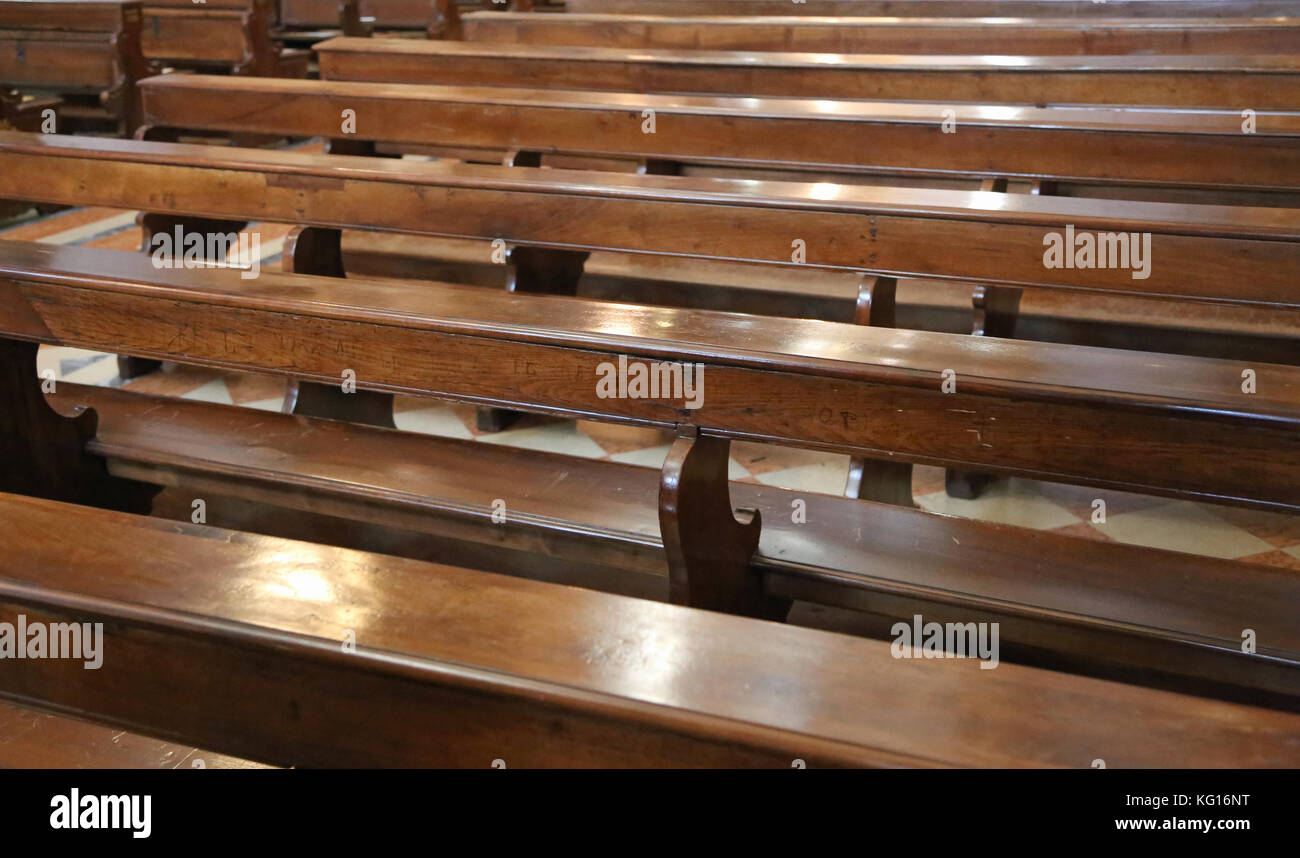 many wooden benches inside a church Stock Photo - Alamy
