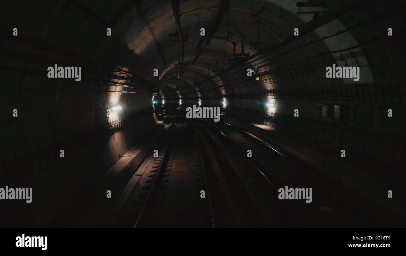 View of subway tunnel as seen from reverse of moving backward train ...