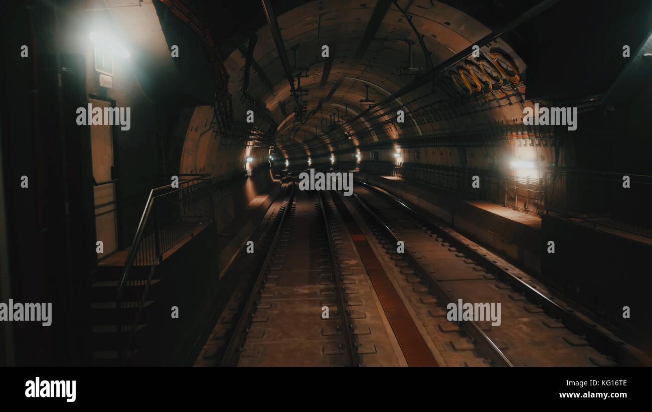 View of subway tunnel as seen from reverse of moving backward train ...