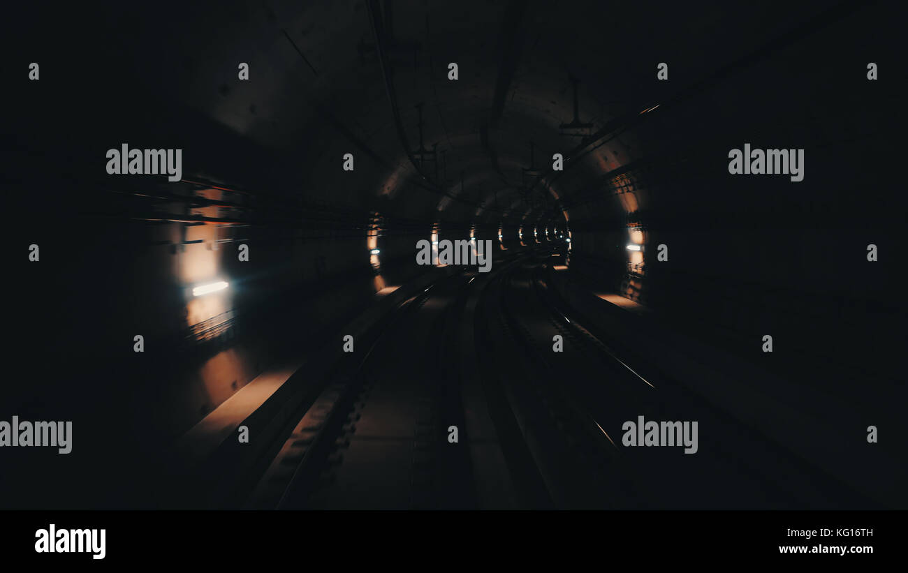 View of subway tunnel as seen from reverse of moving backward train ...