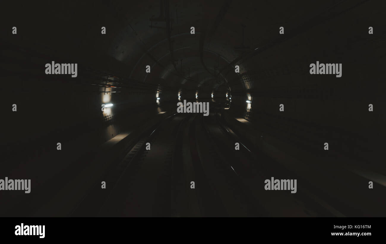 View of subway tunnel as seen from reverse of moving backward train ...