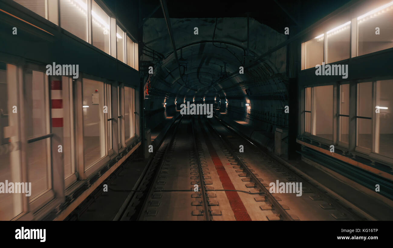 View of subway tunnel as seen from the rear window of moving train ...