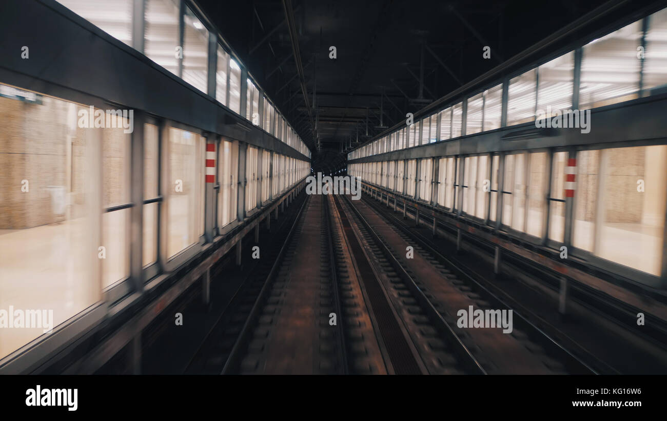 View of subway tunnel as seen from the rear window of moving train ...