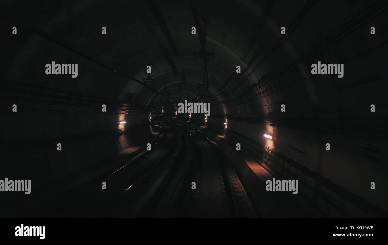 View of subway tunnel as seen from reverse of moving backward train ...