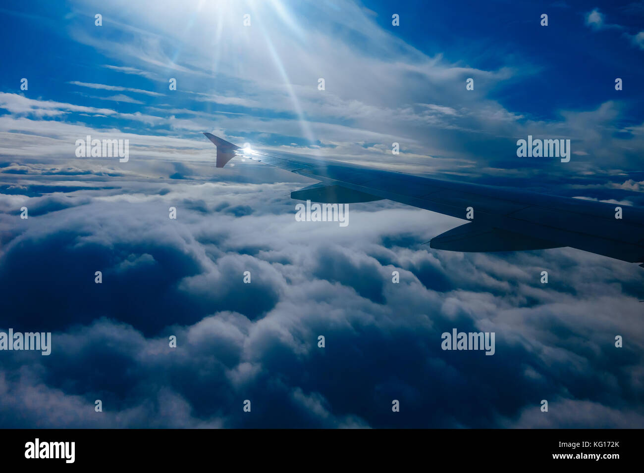 Wing of flying airplane in a fog Stock Photo - Alamy