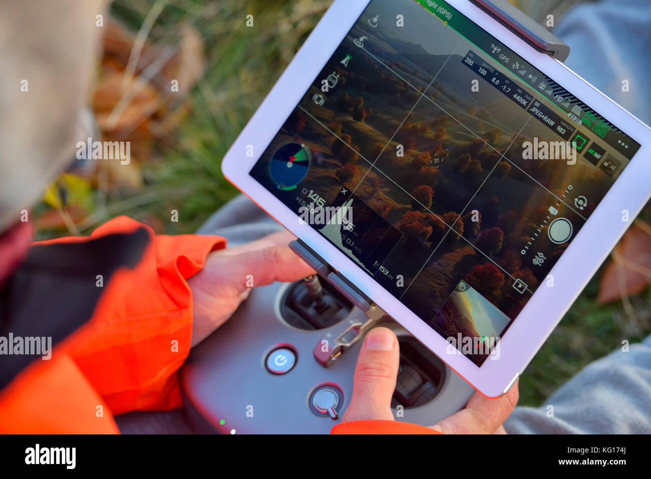 Man handle remote control of drone during capturing photos and video ...