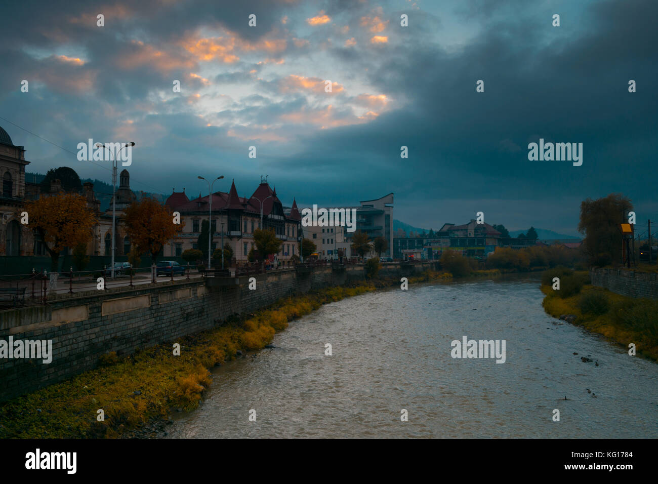 River flowing through a mountain town in northern Romania, after a ...