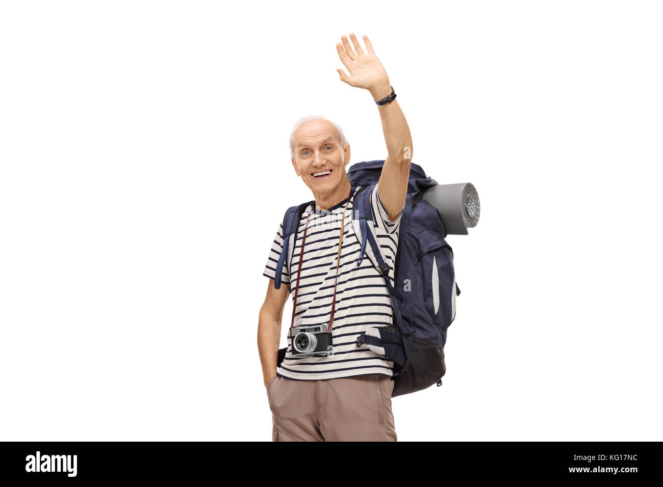 Elderly hiker waving at the camera isolated on white background Stock ...