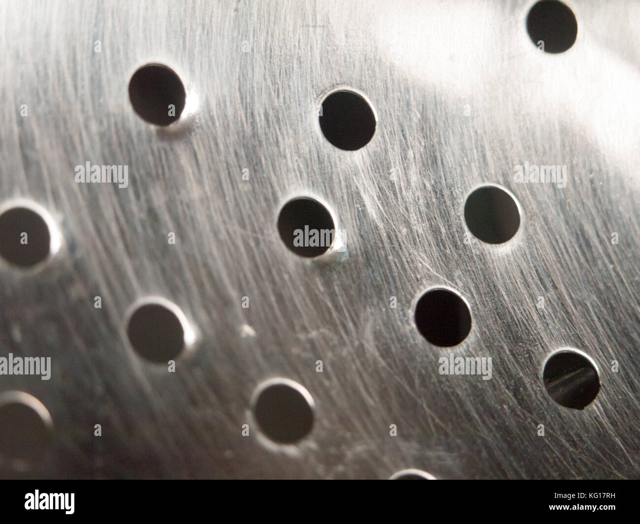 close up of holes in metal sieve colander; essex; england; uk Stock ...