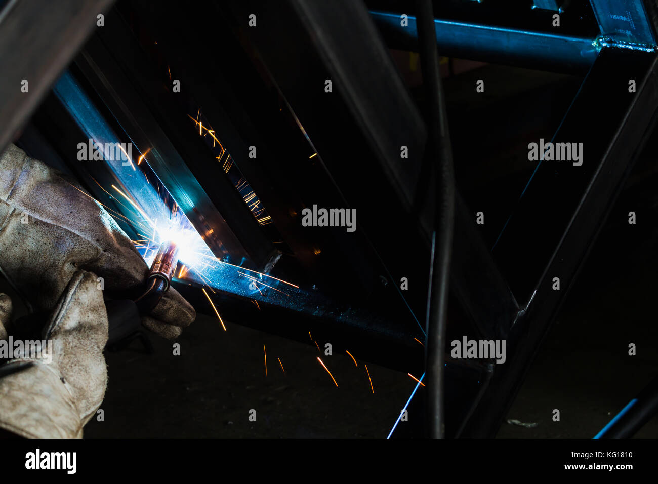 Worker welding metal work blue arc with copy space Stock Photo - Alamy