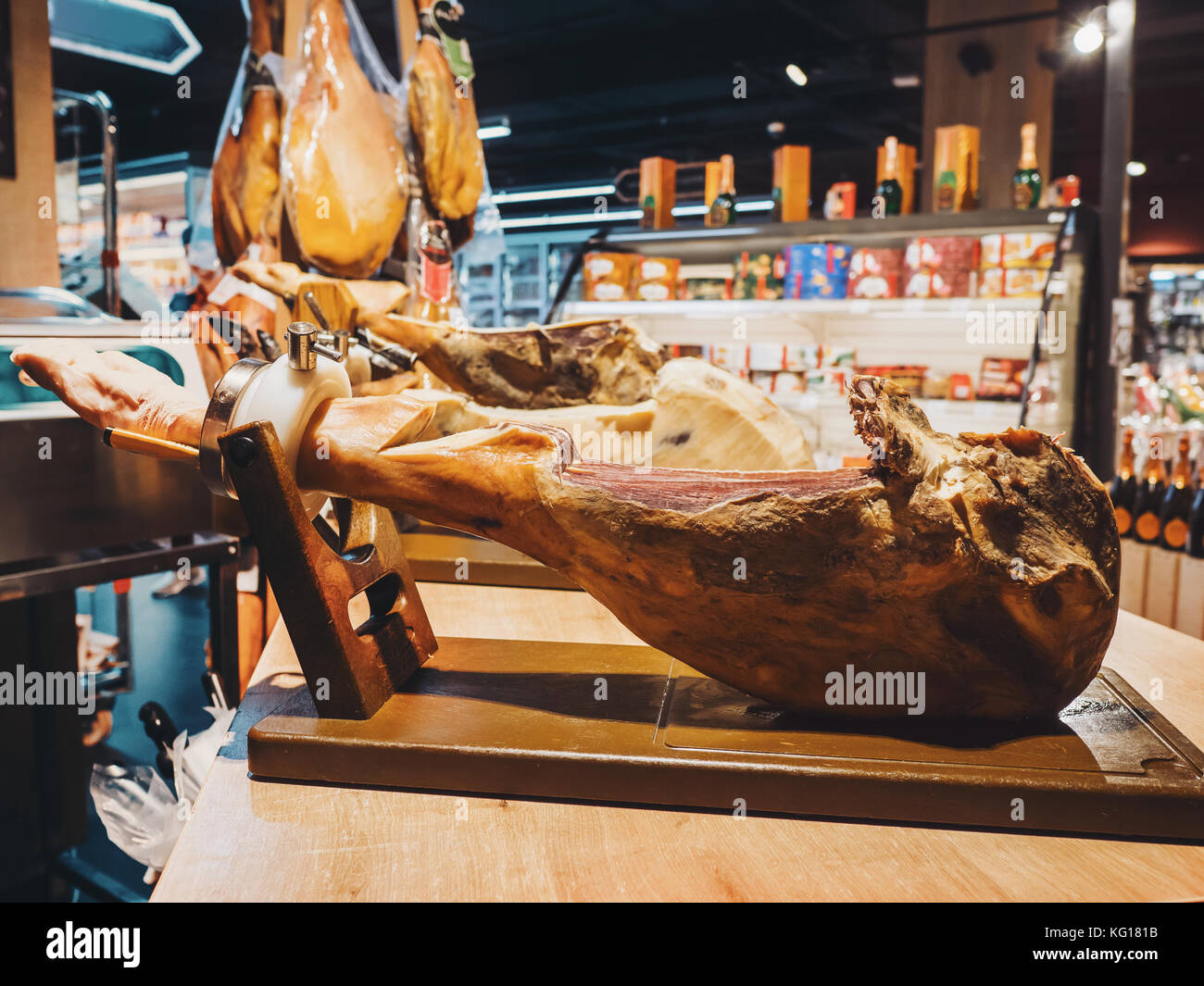 Pork leg on table. Jamon serrano. Traditional Spanish ham in restaurant ...