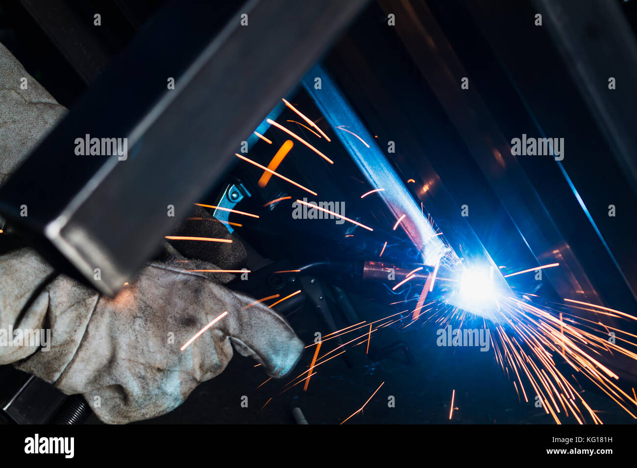 Worker welding metal work blue arc with copy space Stock Photo - Alamy