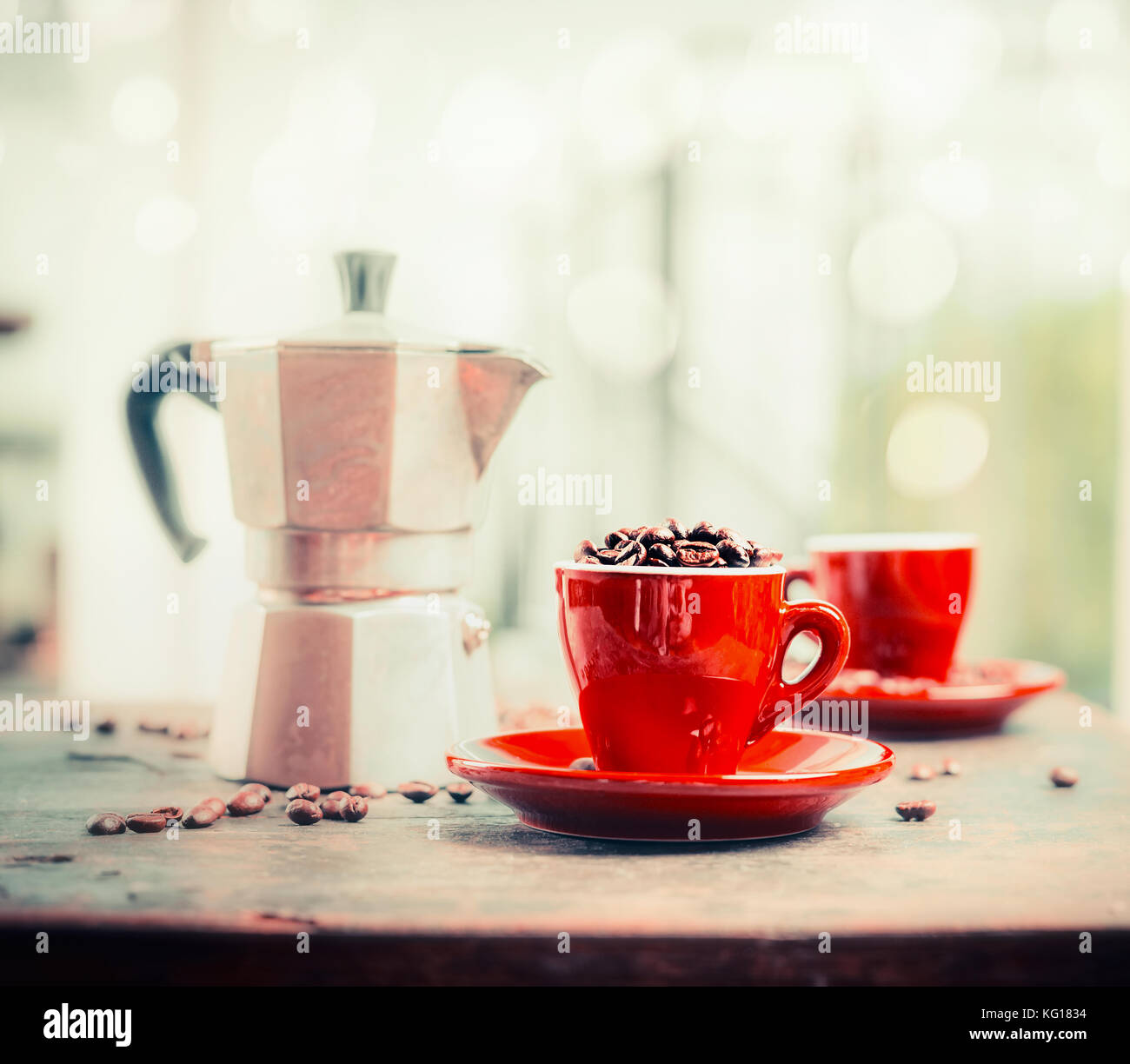 Red espresso coffee cup on table at light background with coffee pot ...