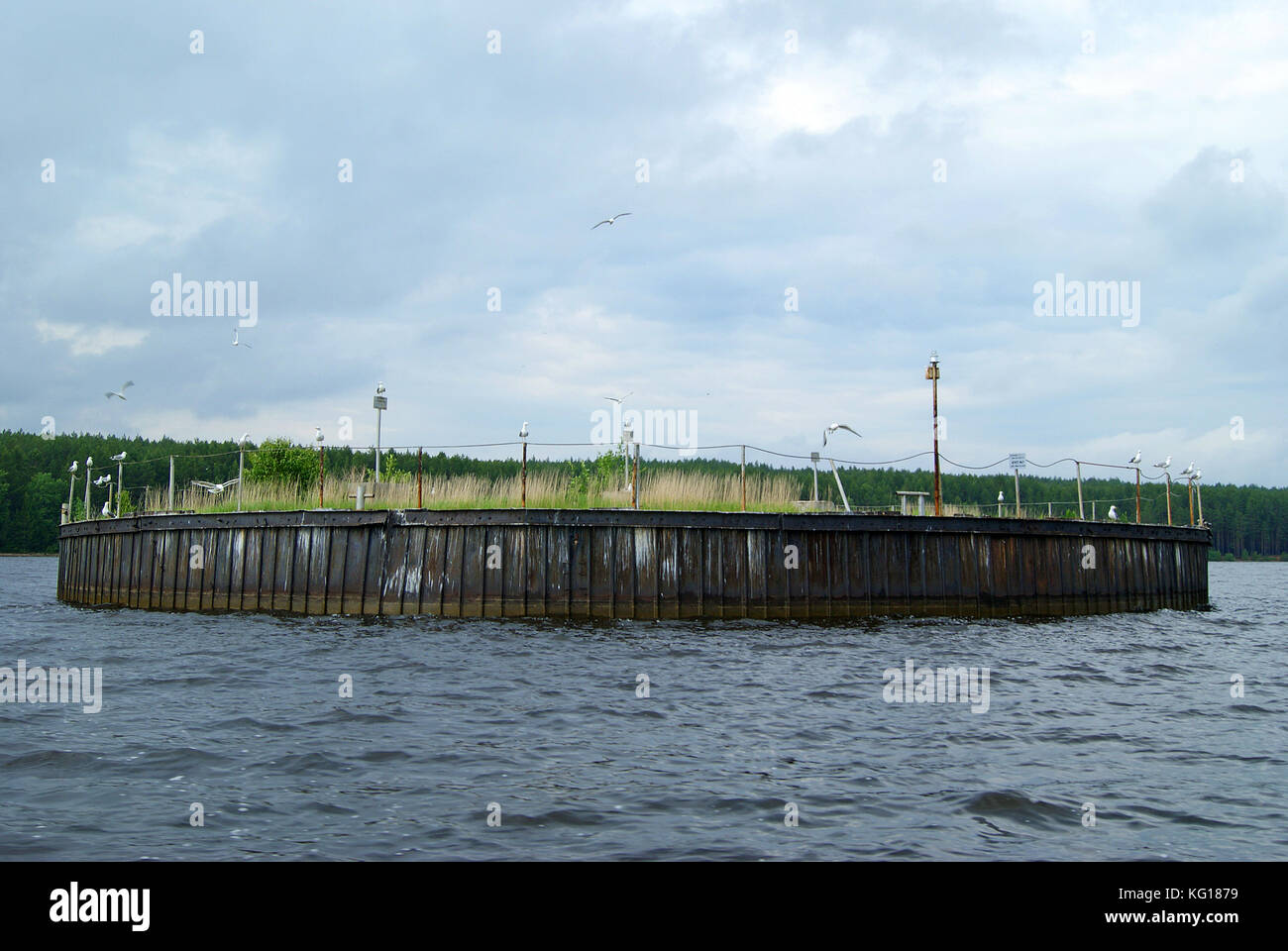 artificial island - the old oil platform in the Kama reservoir, which ...