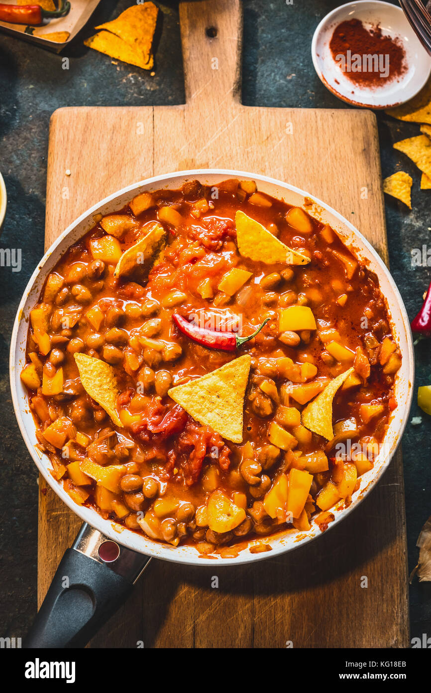 Chili Con Carne in cooking pan with tortilla chips , top view Stock ...
