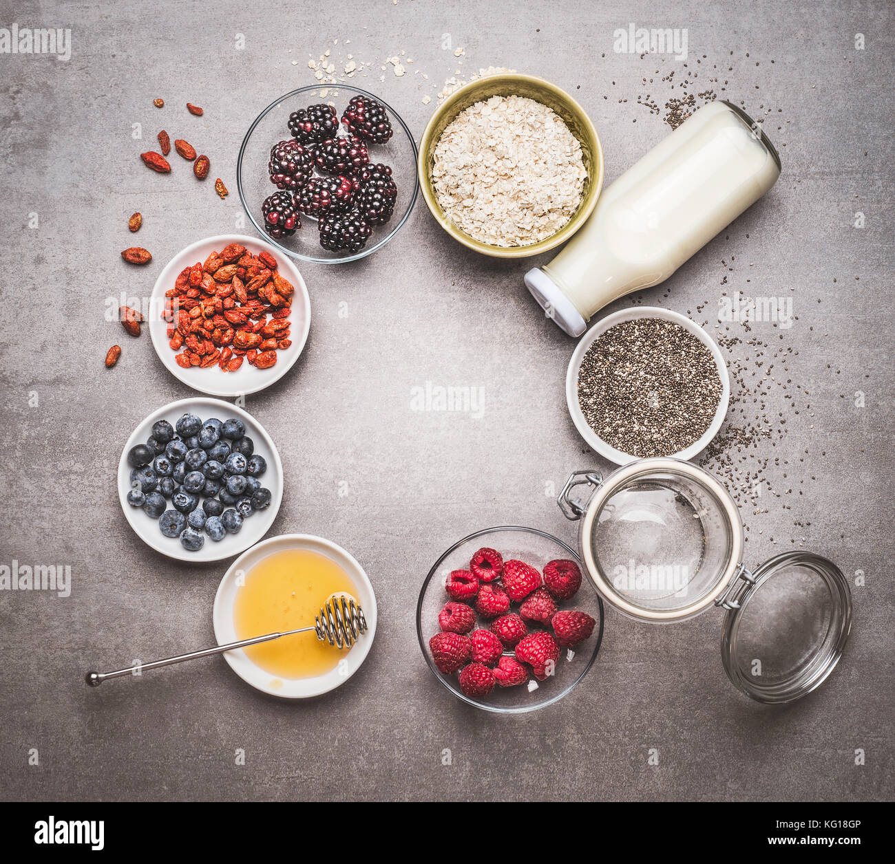 Various Healthy breakfast ingredients with superfood: chia seeds, goji ...