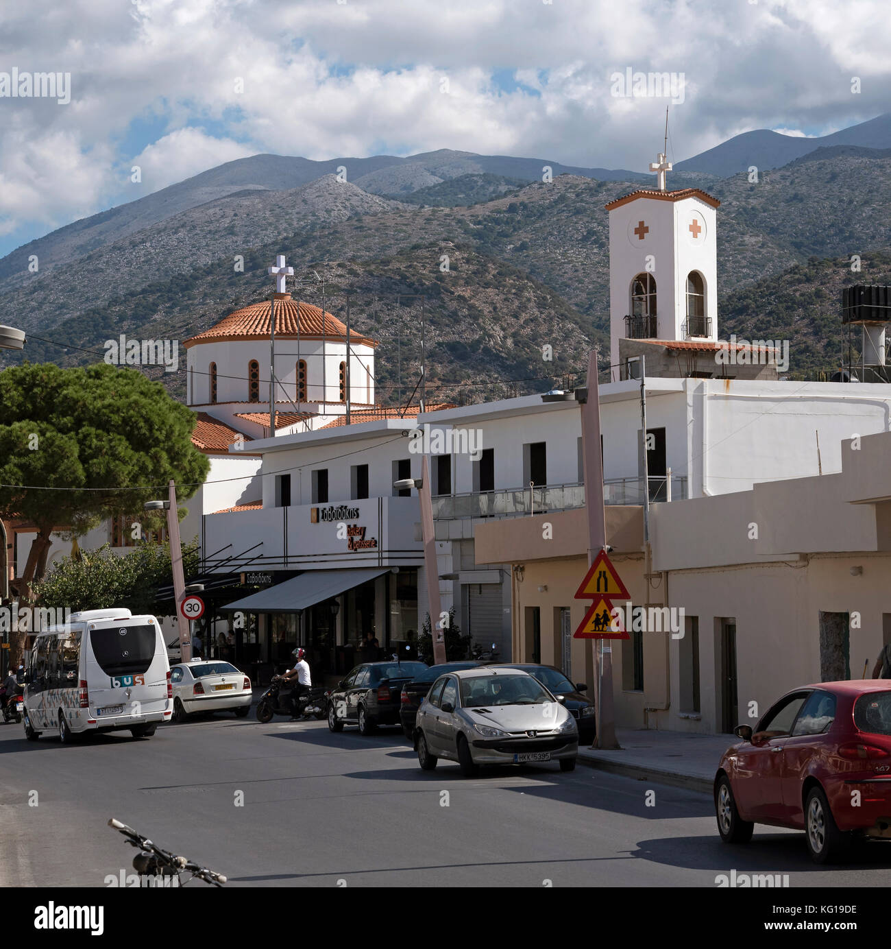 Town centre traffic and church in Malia, Crete, Greece. October 2017 ...