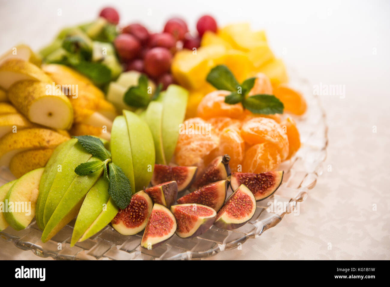 Fruits on plate with passionfruit. restaurant feed Stock Photo - Alamy