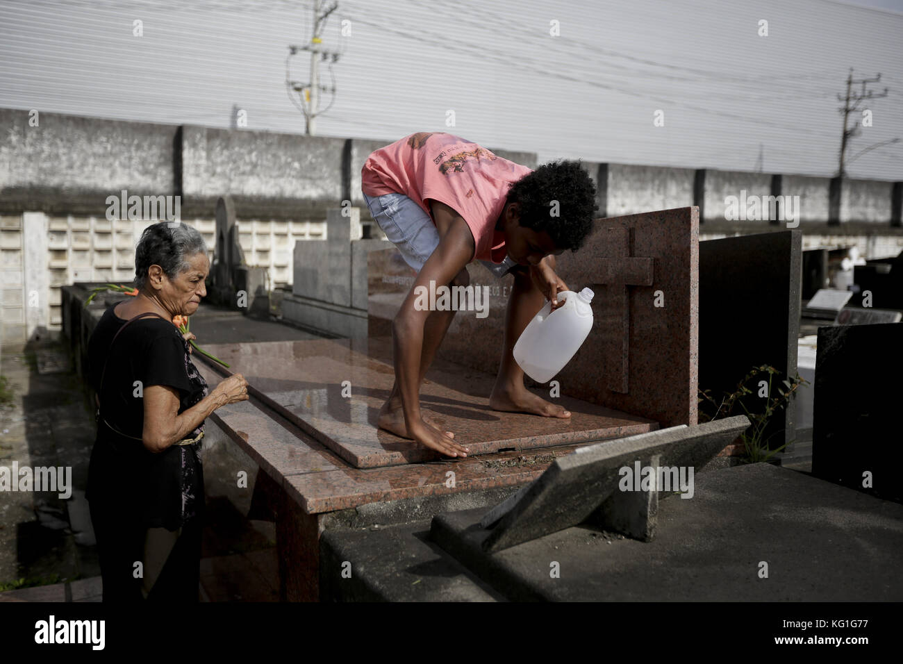Children work cleaning tomb on the day of the deceased. 2nd Nov, 2017 ...