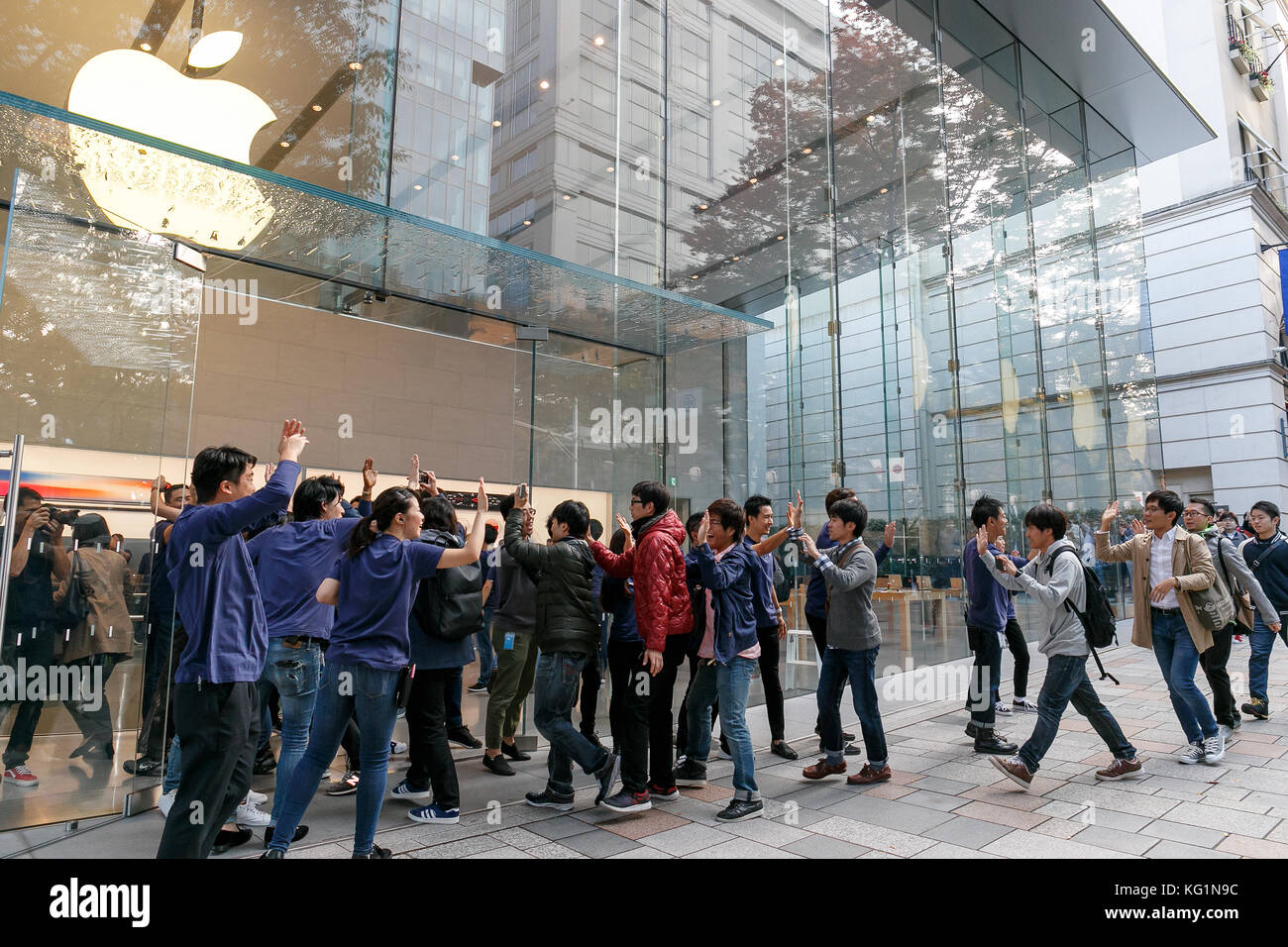 Happy Apple fans enter to the Apple Store in Omotesando to get the new ...