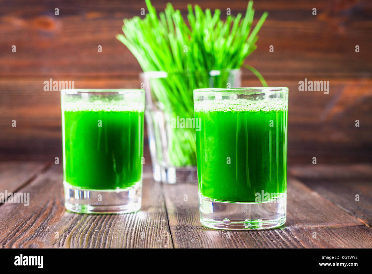 Wheatgrass shot. Juice from wheat grass. Trend of health Stock Photo ...