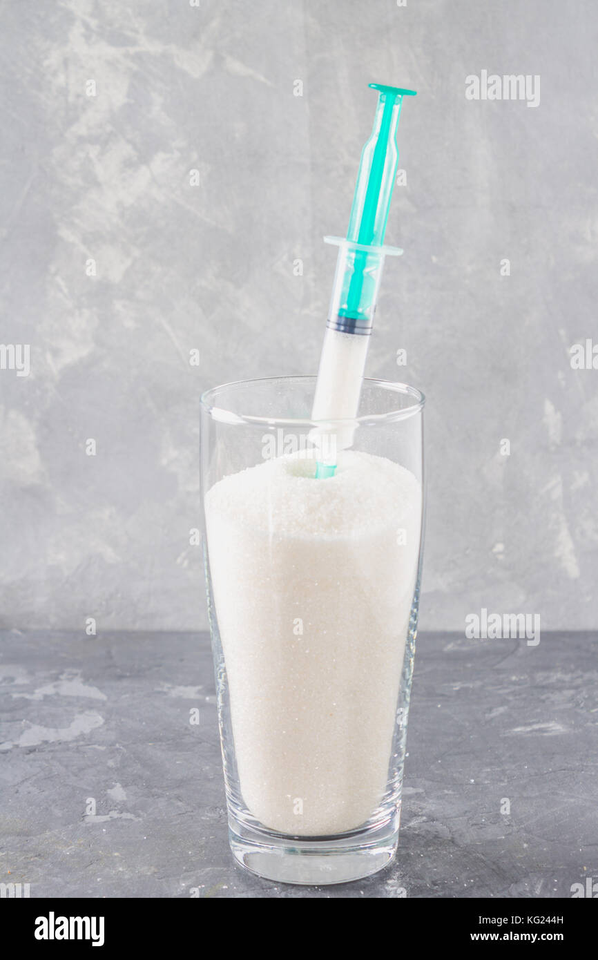 Sugar in a syringe. Conceptual depiction of dependence on the sweet ...