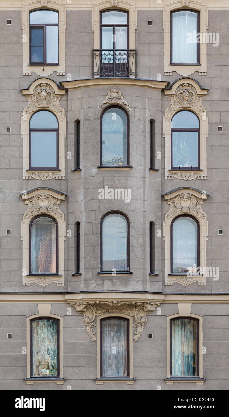 Several windows in a row and bay window on facade of urban apartment ...