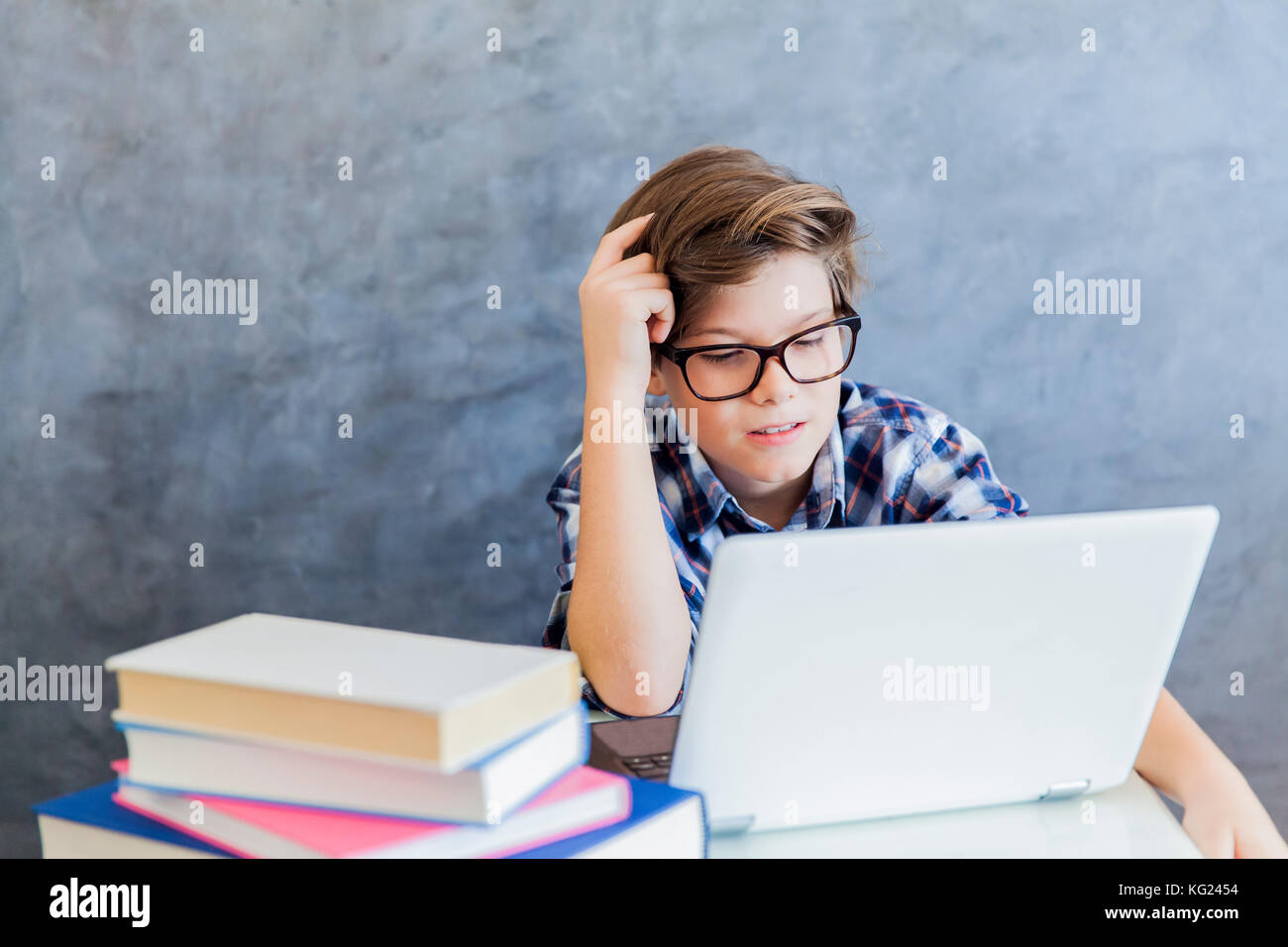 Teen boy glasses working on hi-res stock photography and images - Alamy