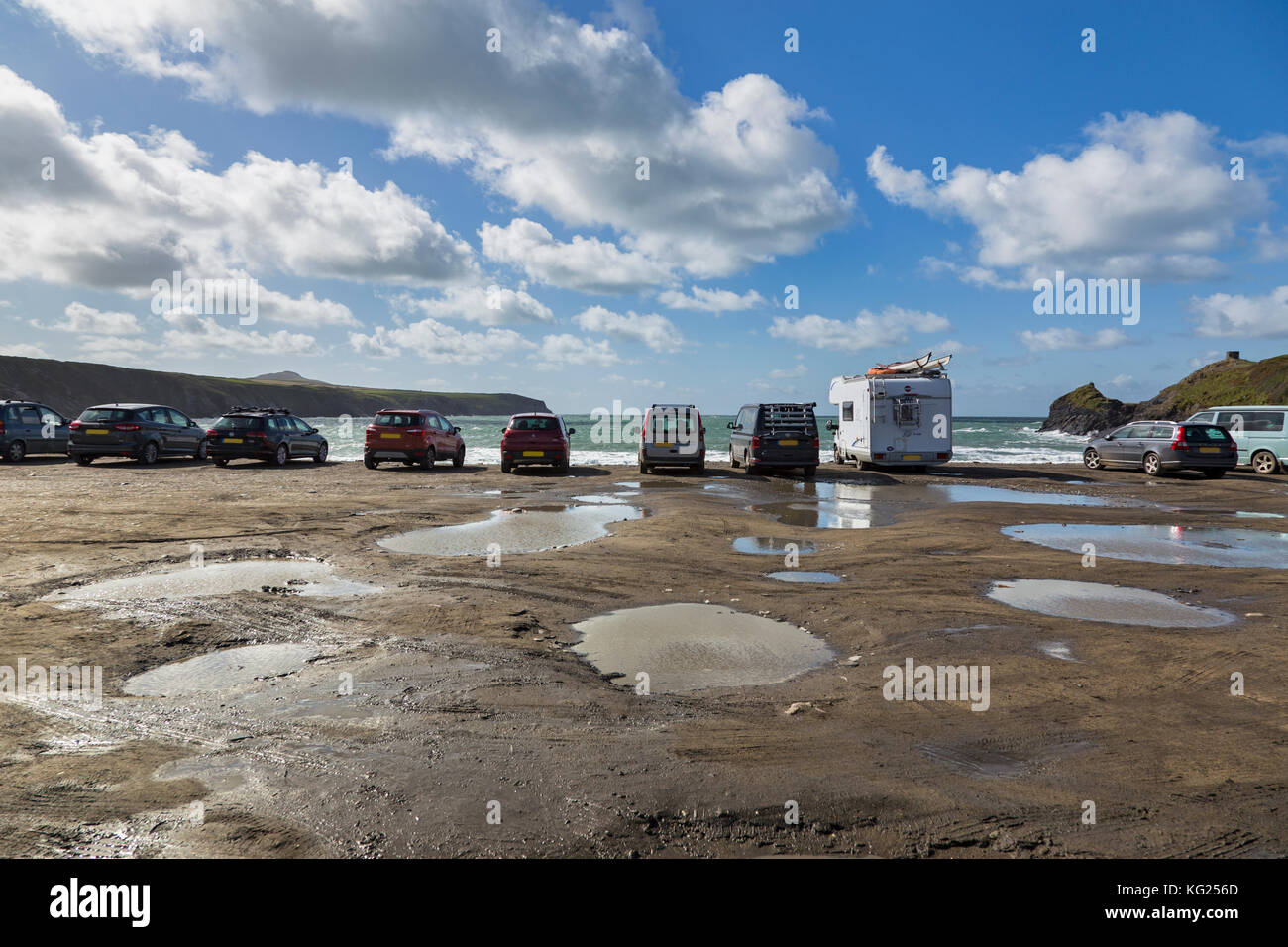 Vehicles parked facing out to sea in West Wales Stock Photo - Alamy